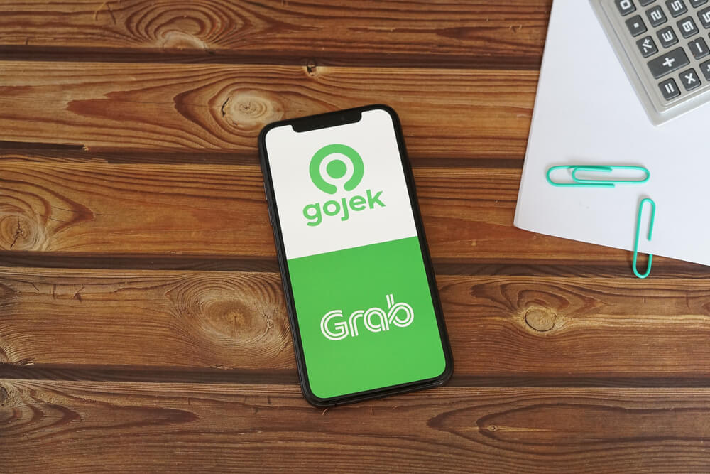 Stres Akibat Pandemi, Grab Didesak Segera Merger dengan Gojek